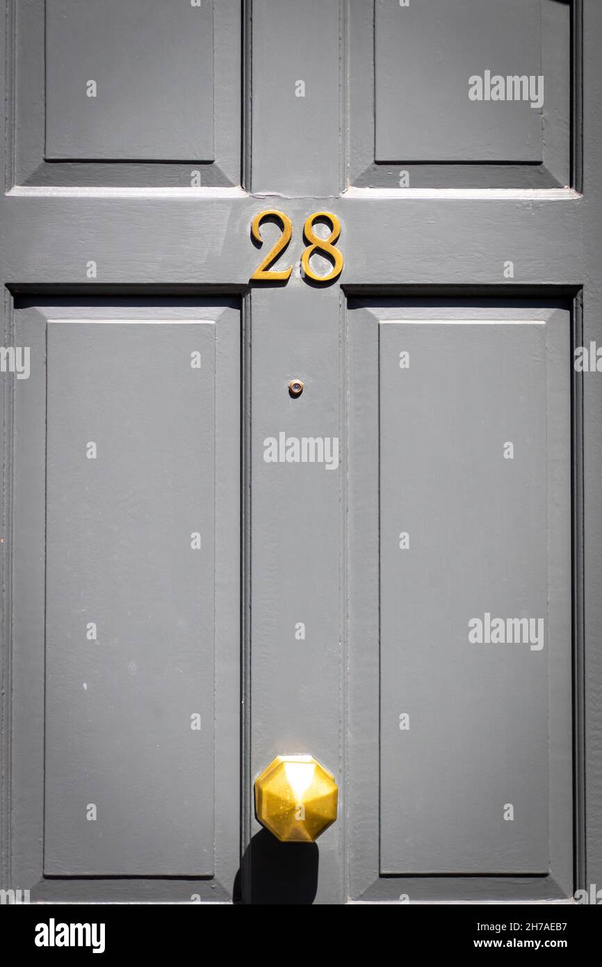 house door number 28 on a wooden front door in London, Britain Stock ...