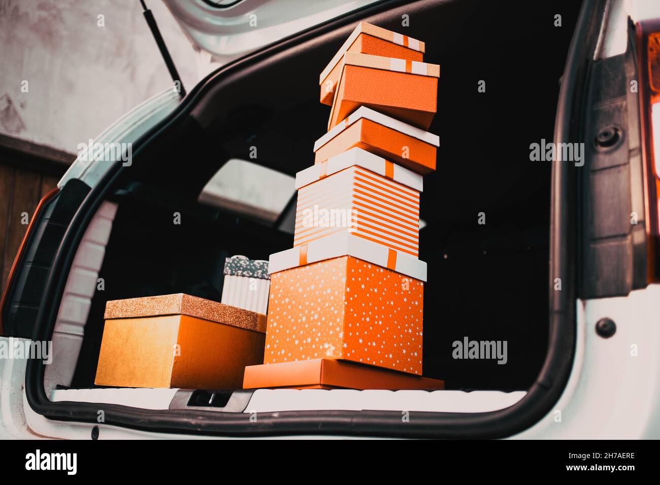pile of Christmas gift boxes in car Stock Photo - Alamy