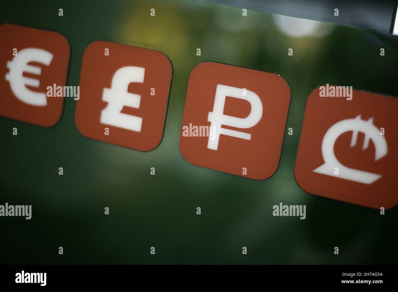 A row of international currency symbol stickers on a glass window Stock ...