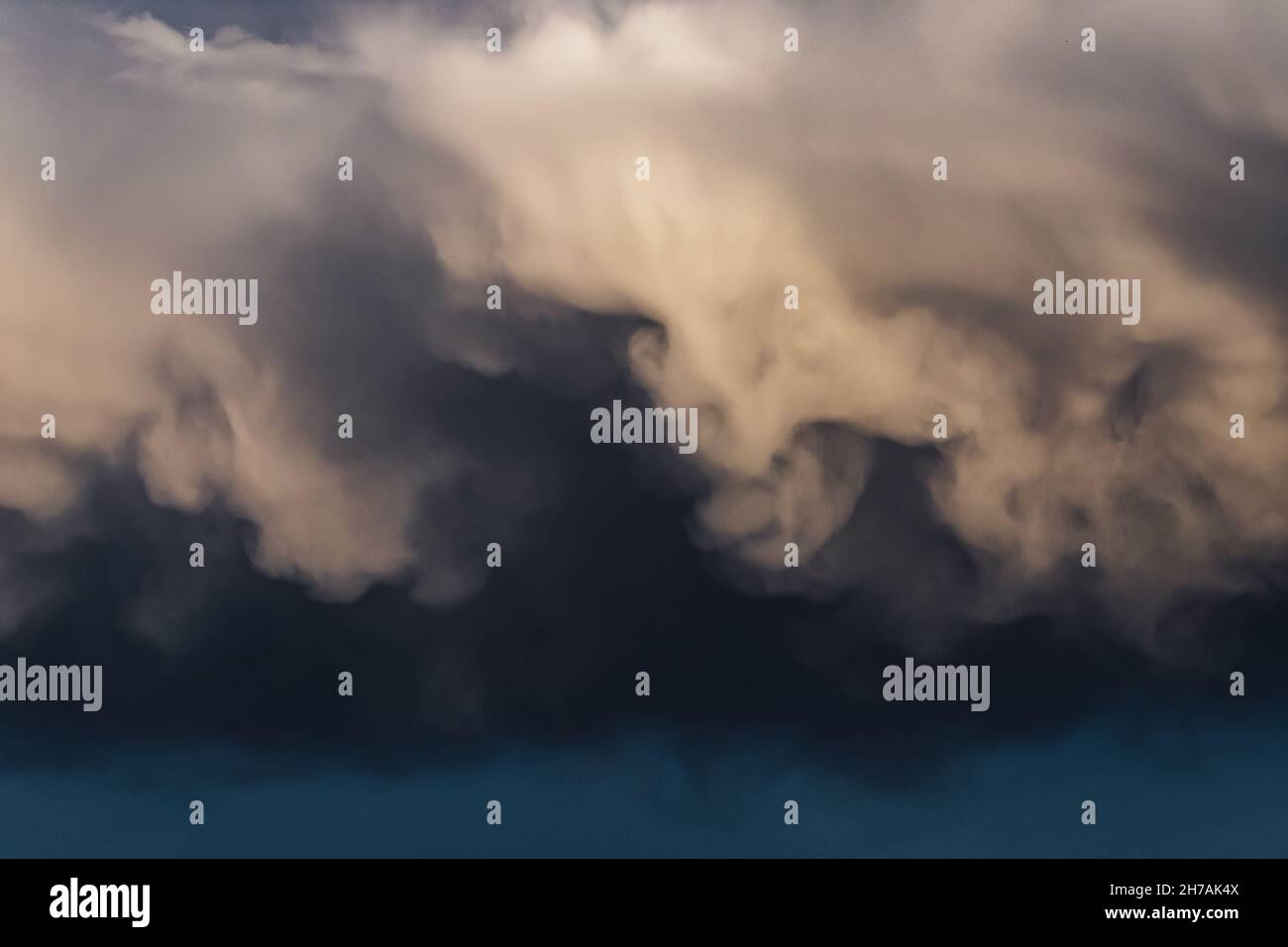 Unusual mammatus and cumulus clouds at dramatic sunset sky Stock Photo ...