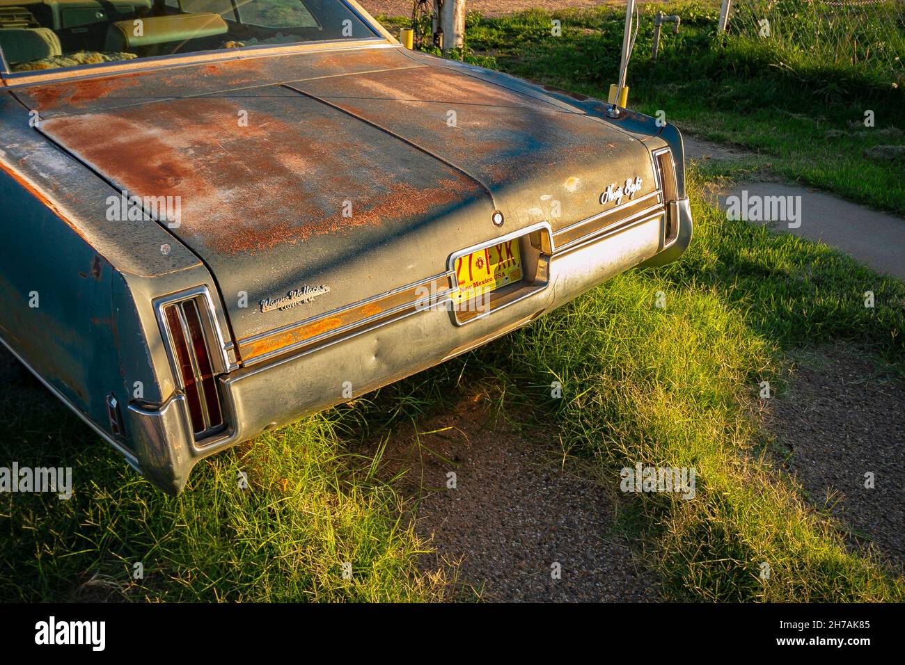 rusty eighty eight 1970s American car on the famous Route 66 Tucumcari ...
