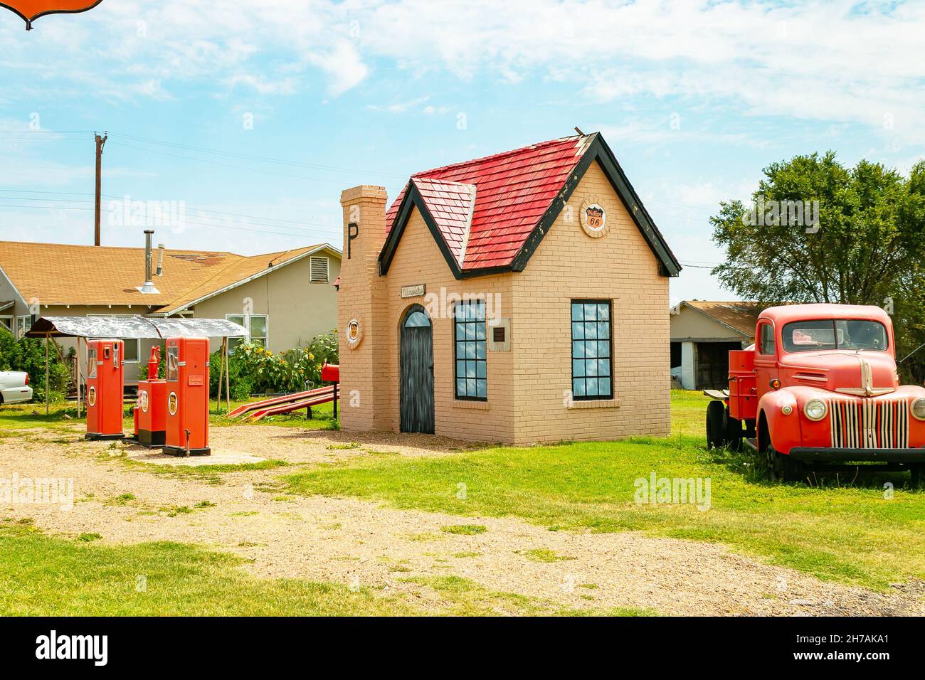 Phillips 66 gas station from 1929 and red 1940s tanker truck on the ...