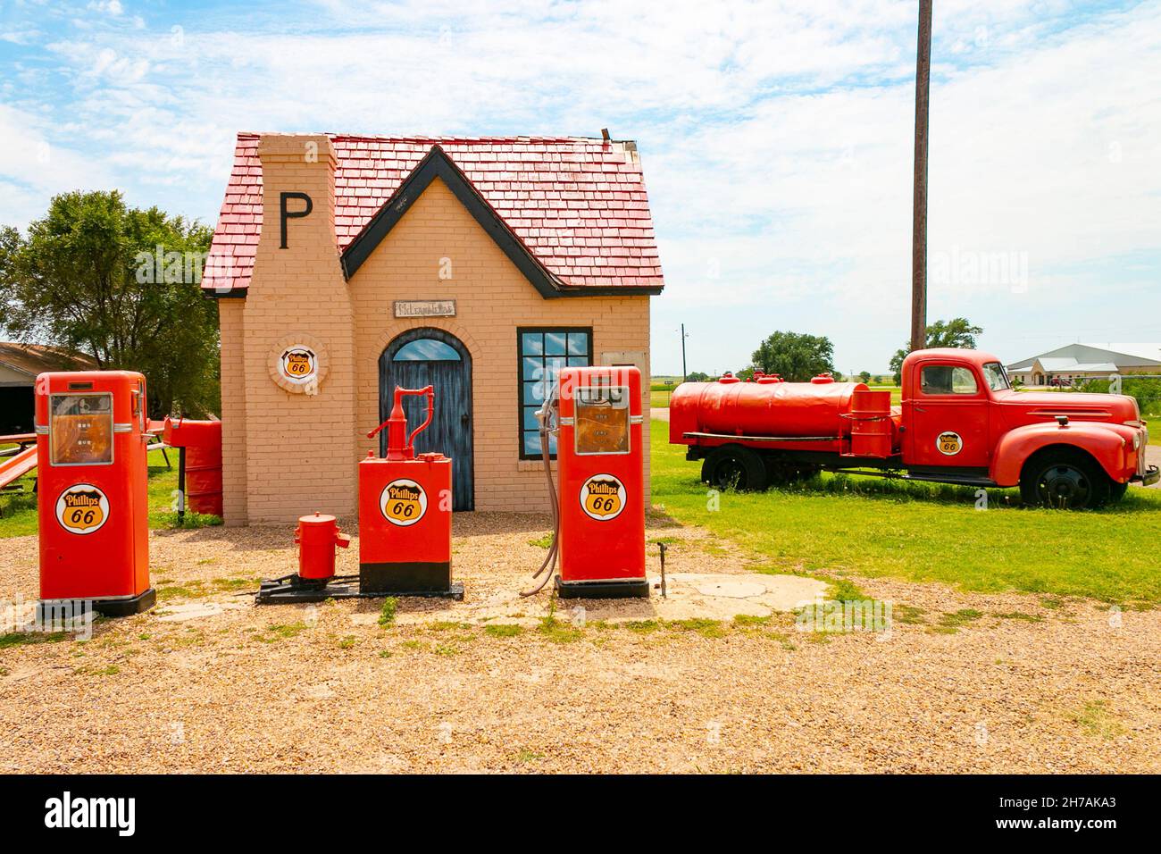 Phillips 66 gas station from 1929 and red 1940s tanker truck on the ...