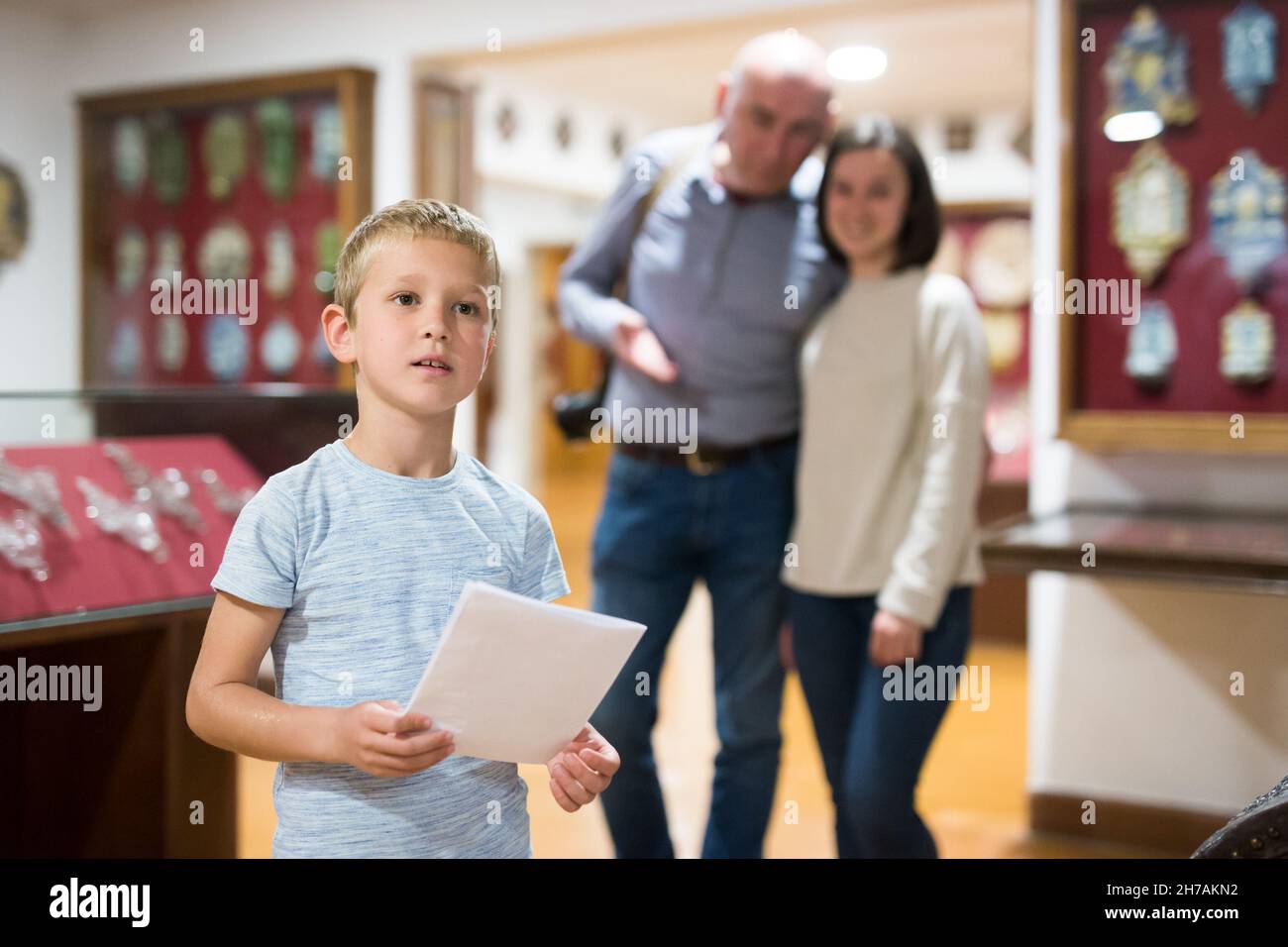 Family visiting museum Stock Photo - Alamy