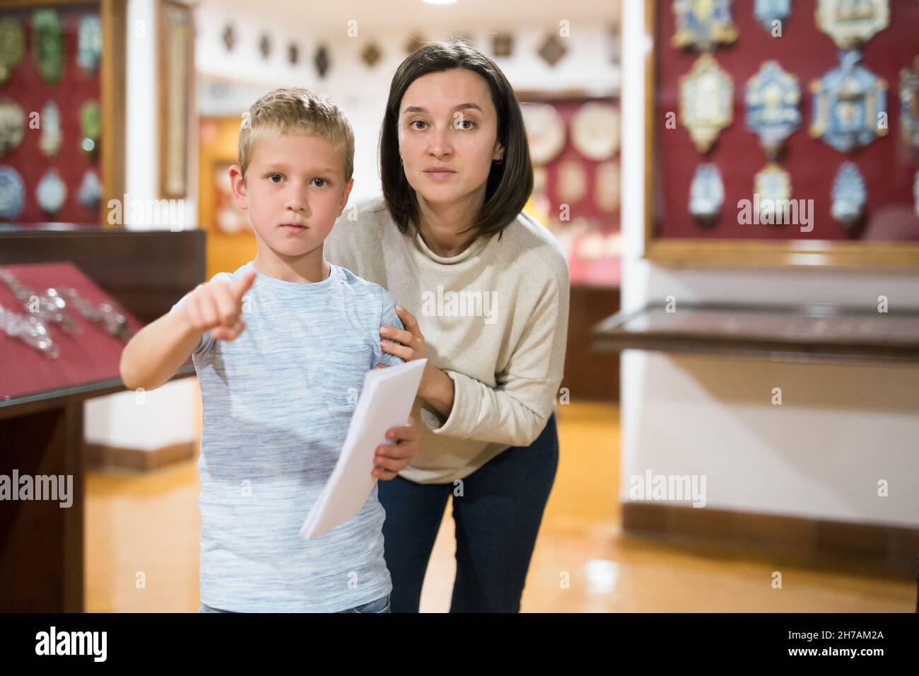 Family visiting historical museum Stock Photo - Alamy