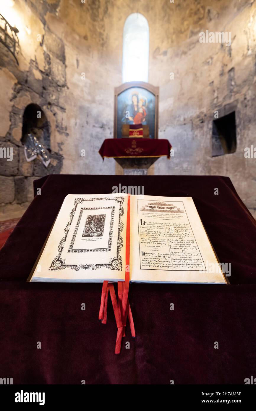 20 May 2021, Odzun, Armenia: A holy manuscript book with text in ...