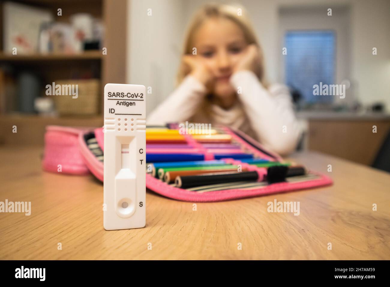 Girl child self testing at home for coronavirus before going to school ...