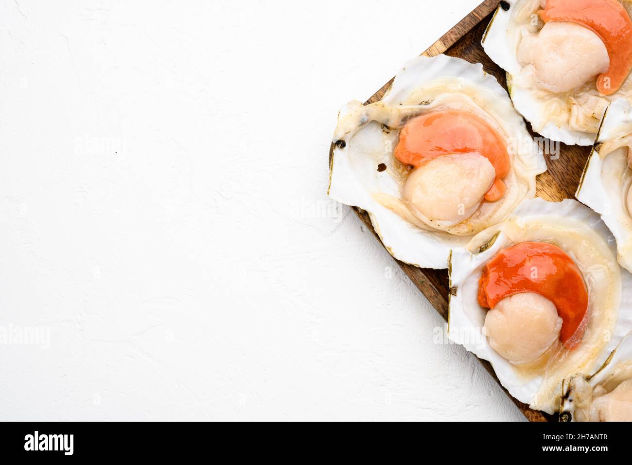Fresh french scallops seafood market set, on white stone table ...
