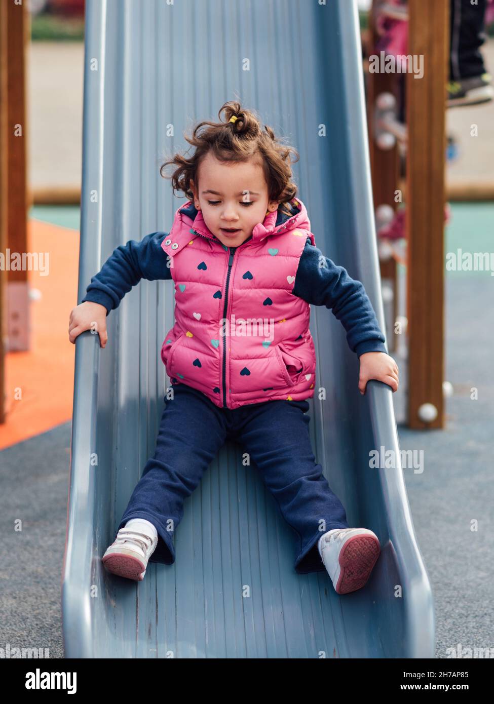 Happy Little Girl Sliding Fotolia