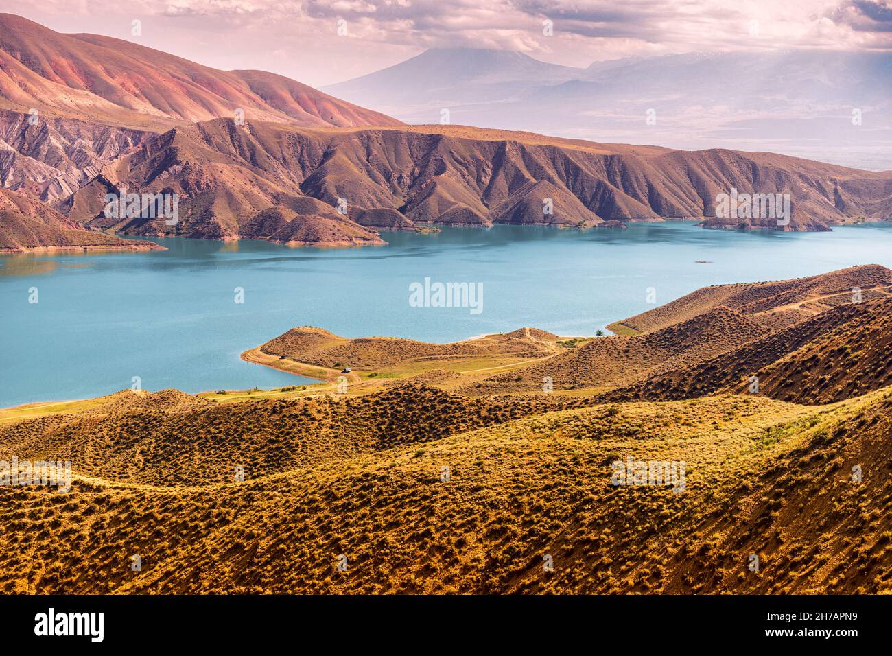 A picturesque reservoir with blue water in an arid area. The concept of ...