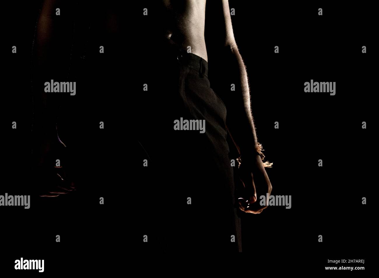 Details of the arms and hands of an actor in the theater representing a ...