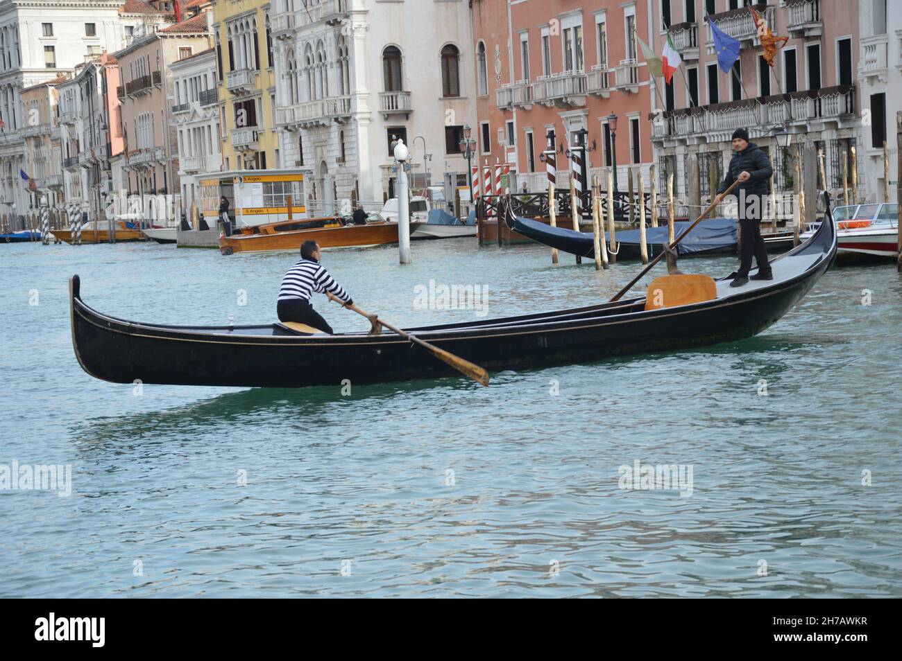 A traditional gondola rowing boat on the Grand Canal in Venice, Italy ...