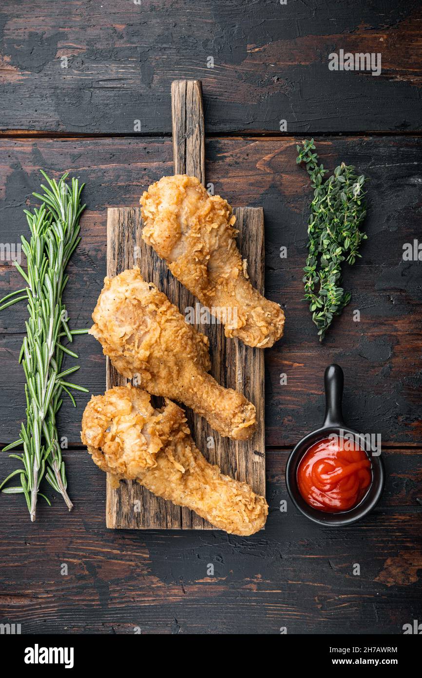 Crispy fried chicken cuts on dark wooden background, top view Stock ...