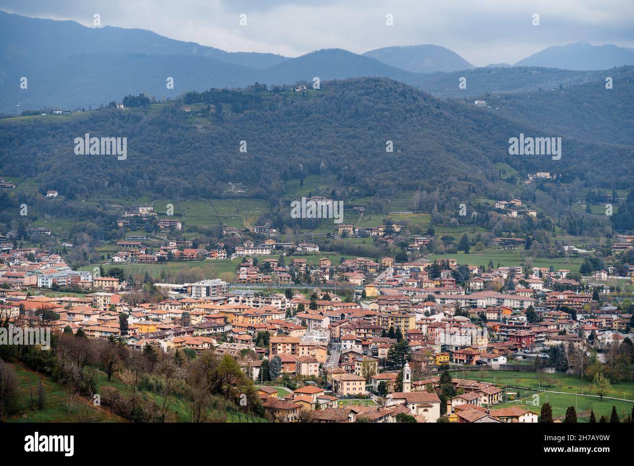 Bergamo at the foot of the green mountains. Italy Stock Photo - Alamy