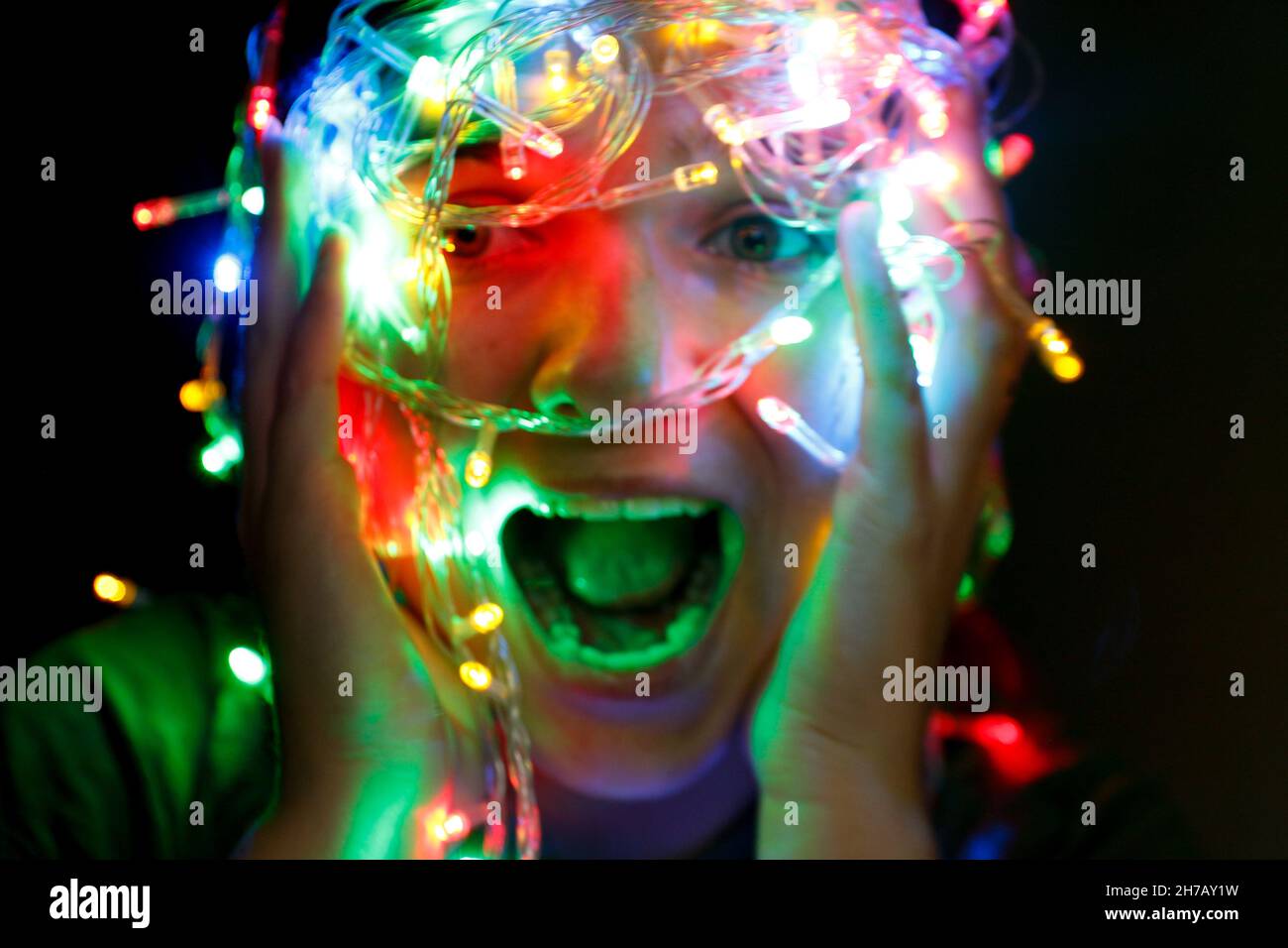 Woman is clutching her head in a panic. Stressed Christmas Girl ...