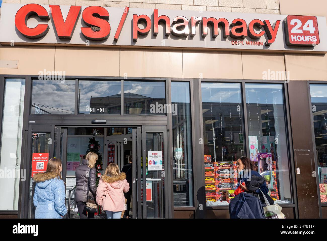 NEW YORK, NY - NOVEMBER 21: Storegoers visit a CVS store in Astoria on ...