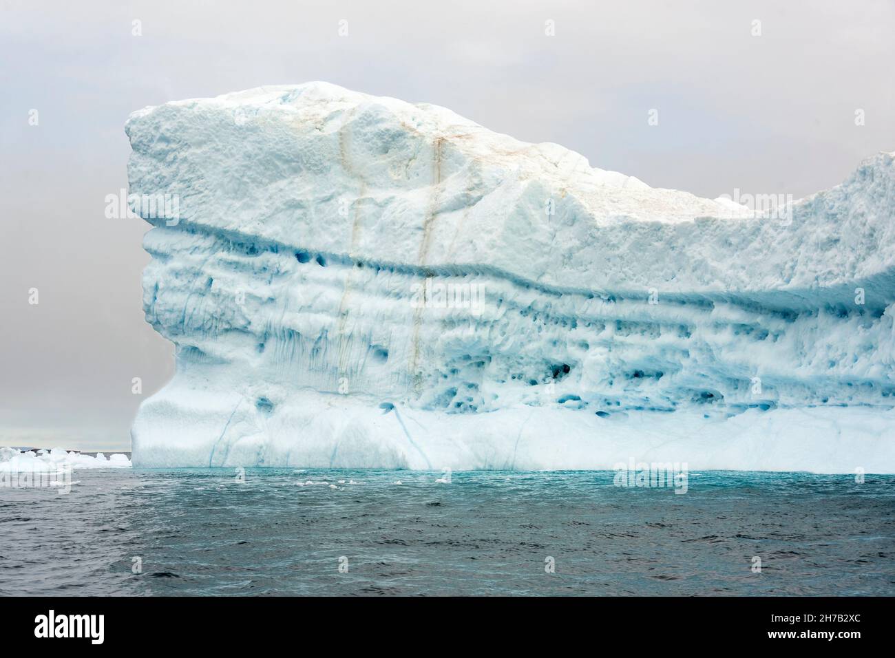 Ice striations in an old iceberg off Denmark Island, Scoresby Sund ...