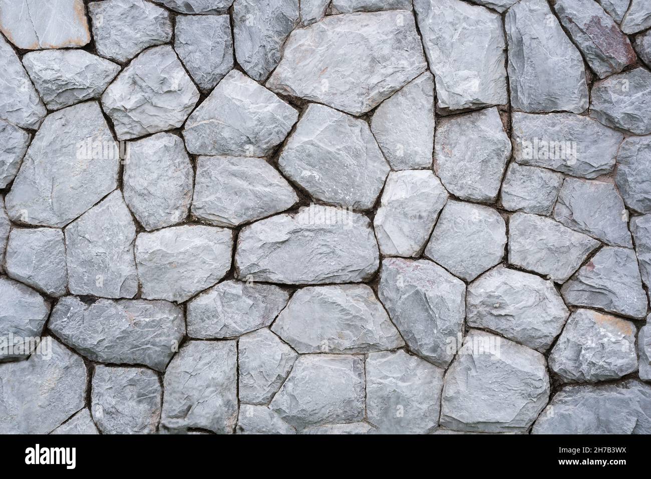 Stone wall background. Texture wall from gray round stones Stock Photo ...