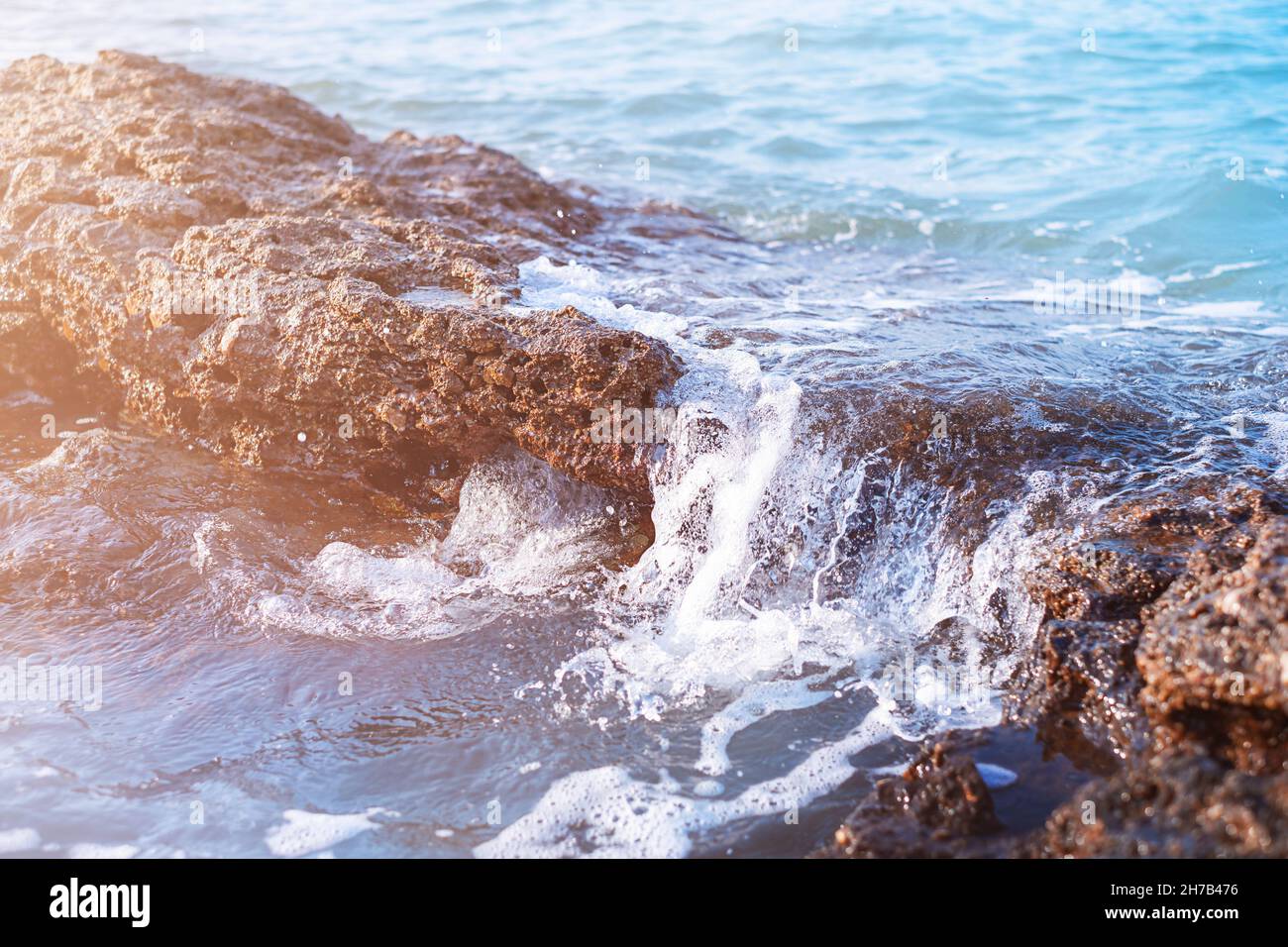 Sea water flows over rocks in the ocean. Natural background Stock Photo ...
