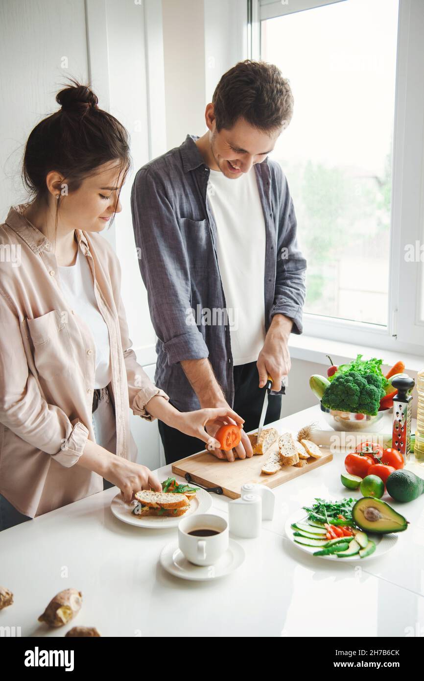 Romantic couple preparing healthy meal together. Spending morning ...