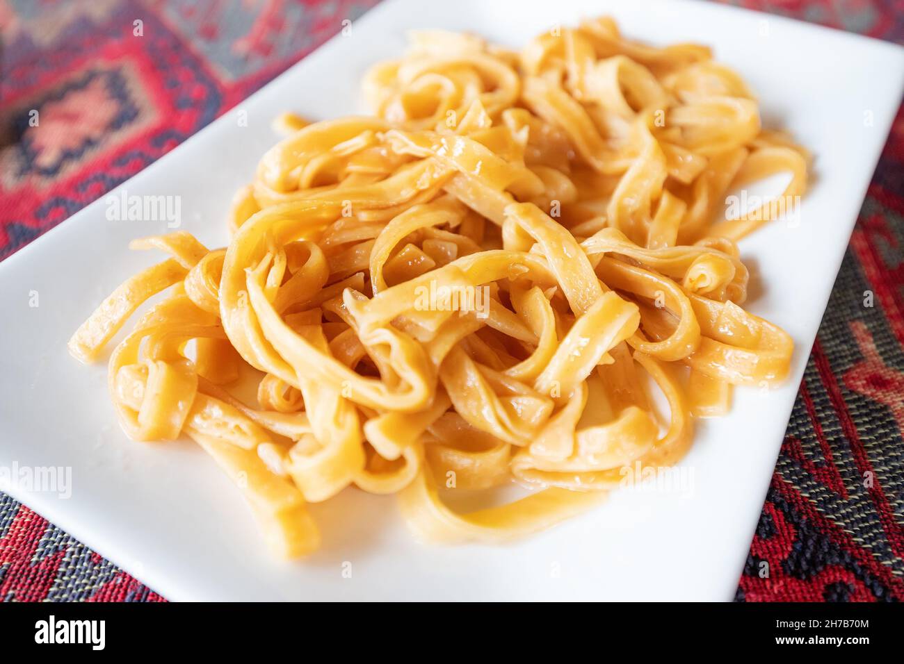 A plate with traditional Armenian noodles Arishta. National folk ...