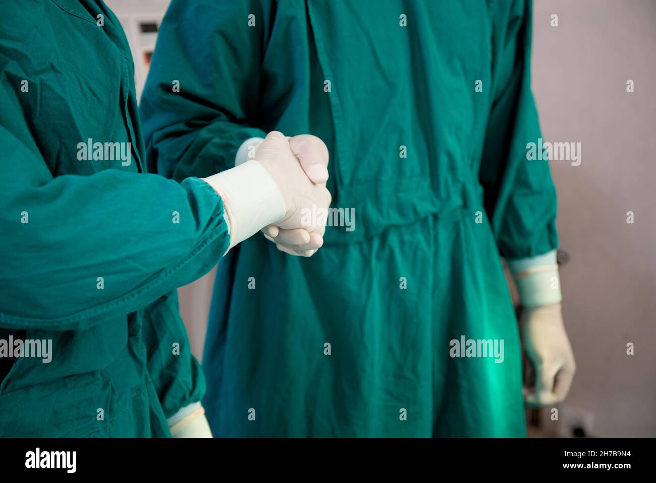 Teamwork of doctor and assistant handshake with success together at ...