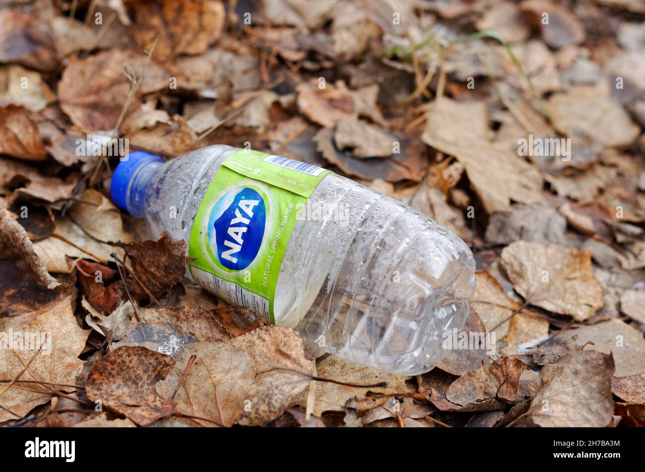 Empty plastics bottle of water laying on the ground. Quebec,Canada ...