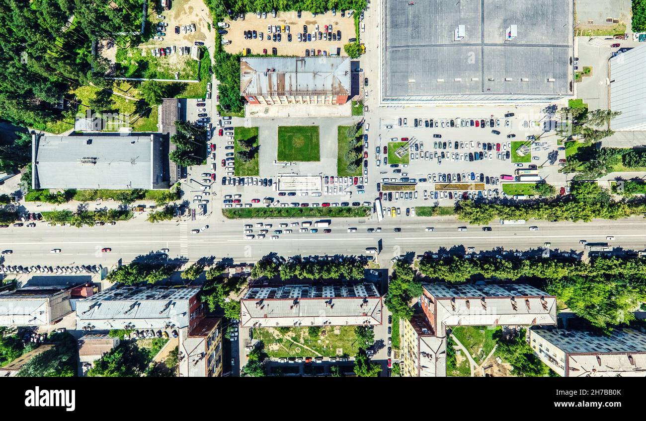 Aerial city view with crossroads and roads, houses, buildings, parks ...