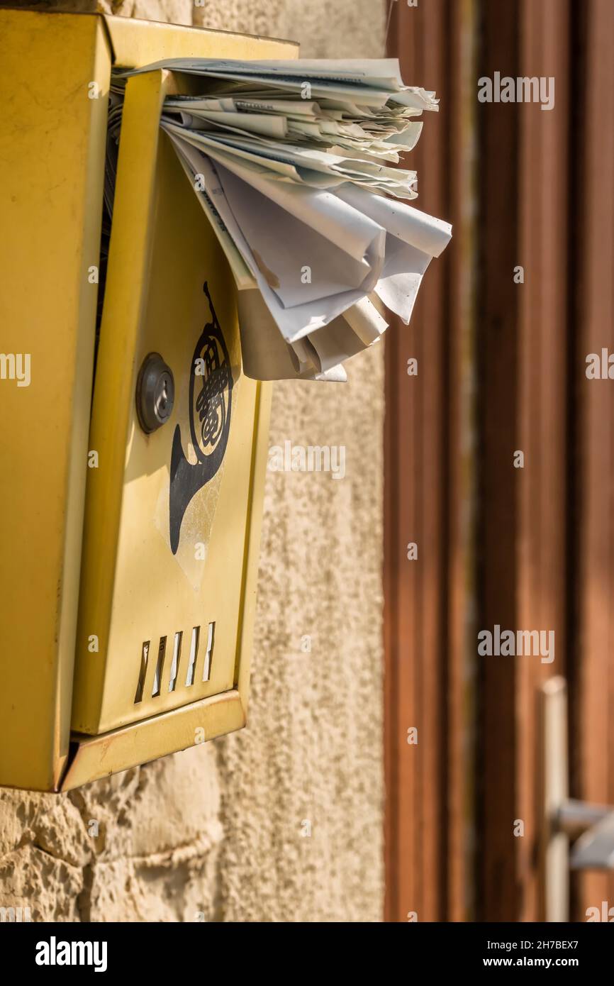 Typical overfull old post box Stock Photo - Alamy