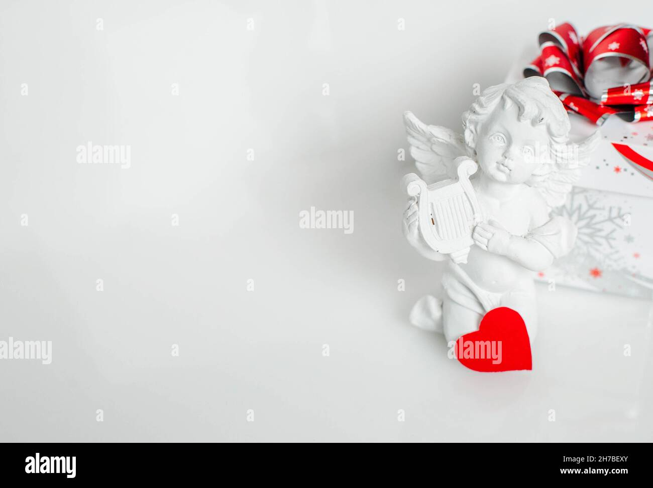 ceramic angel and gift box Stock Photo - Alamy