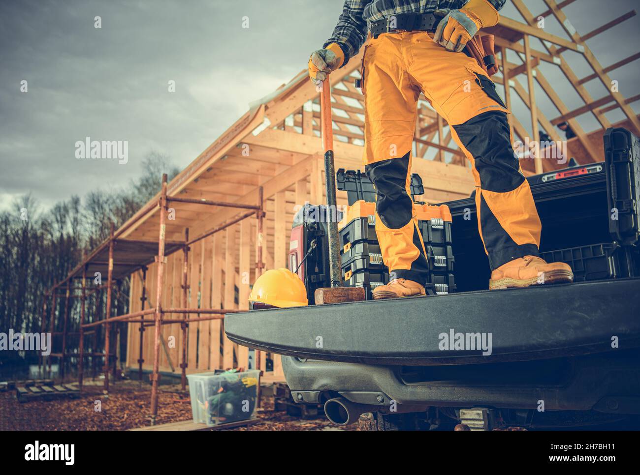 Contractor Worker and the Construction Site. Men with Large Hammer ...