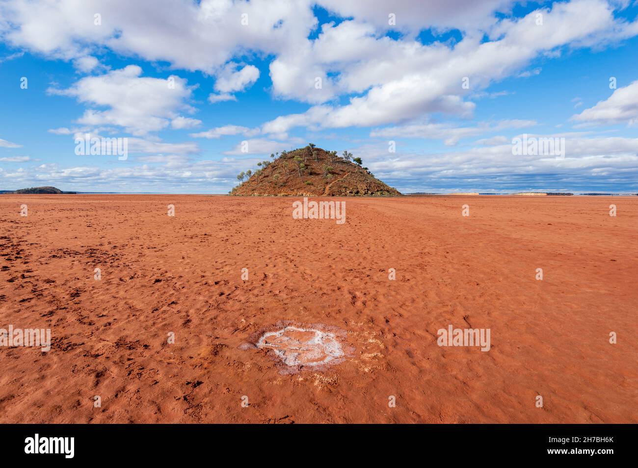 Scenic view of patterned red crust and conical island in the middle of ...