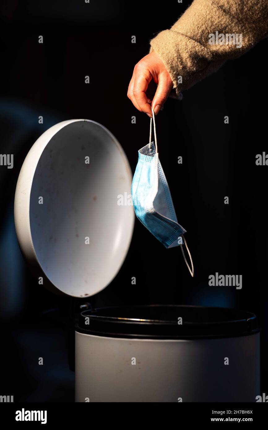 mask in bin, rubbish, garbage and trash. Littering a safety mask in ...