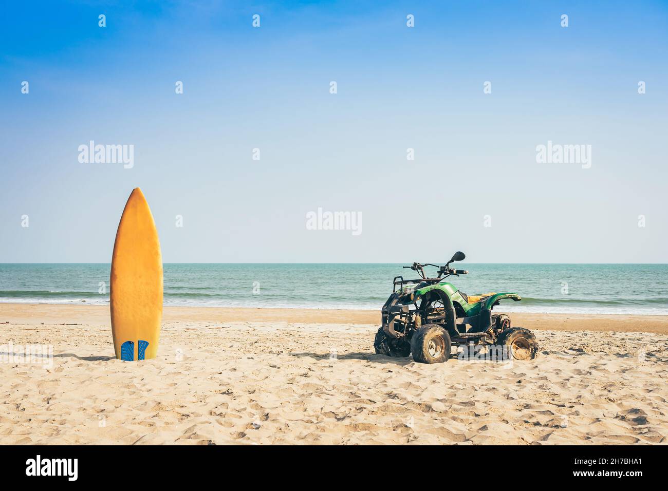 Vintage green ATV on the sandy beach. Quad ATV all terrain vehicle ...