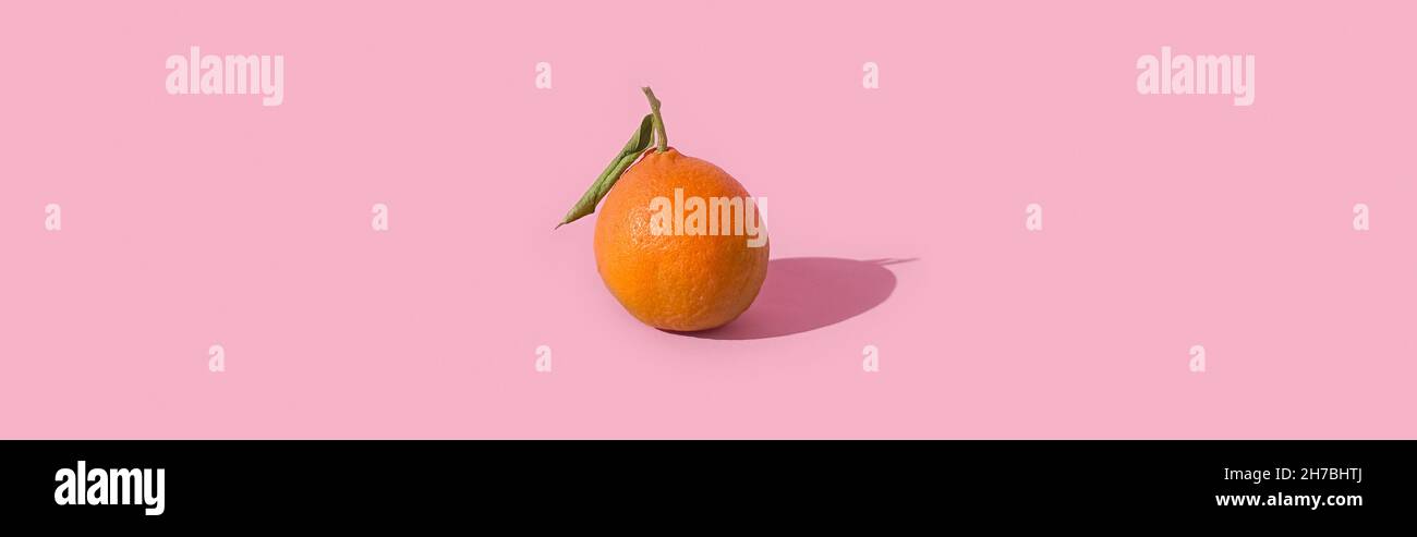 fresh tangerine on pink background Stock Photo - Alamy