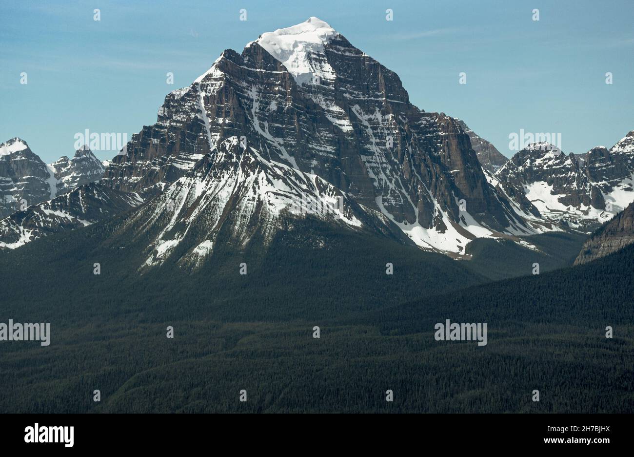 Chilling view of a snow-capped mountain under a clear blue sky Stock ...