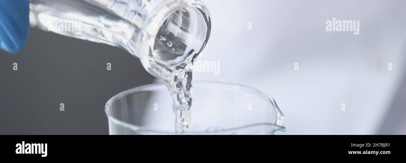 Scientist examines drinking water in laboratory closeup Stock Photo - Alamy