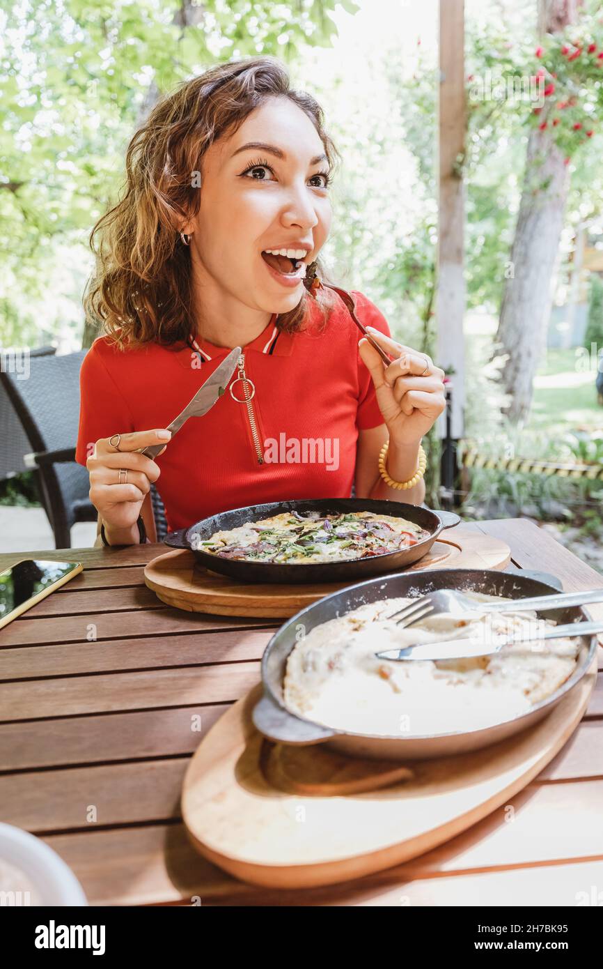 Woman frying bacon hi-res stock photography and images - Alamy