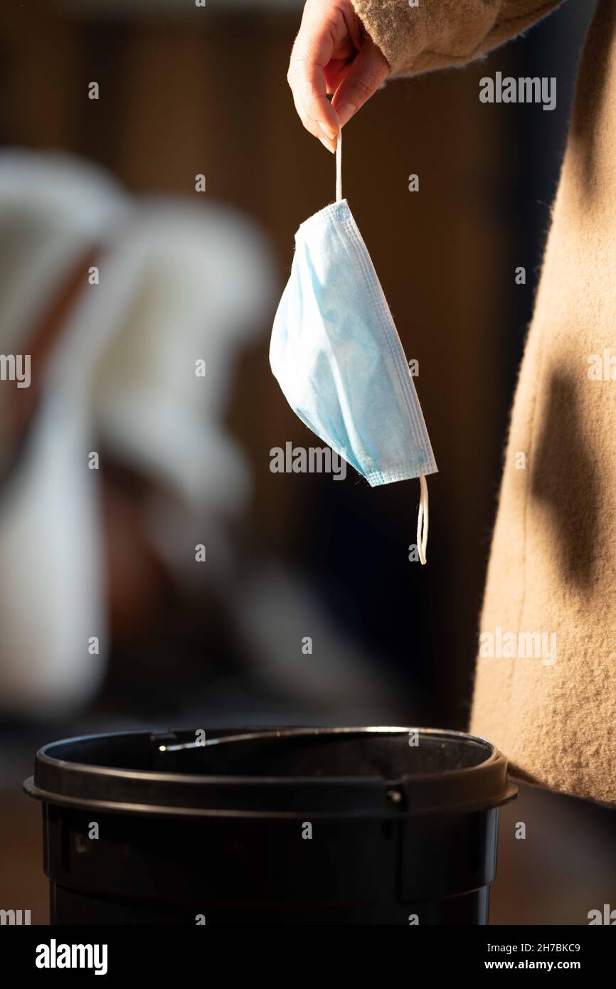 mask in bin, rubbish, garbage and trash. Littering a safety mask in ...