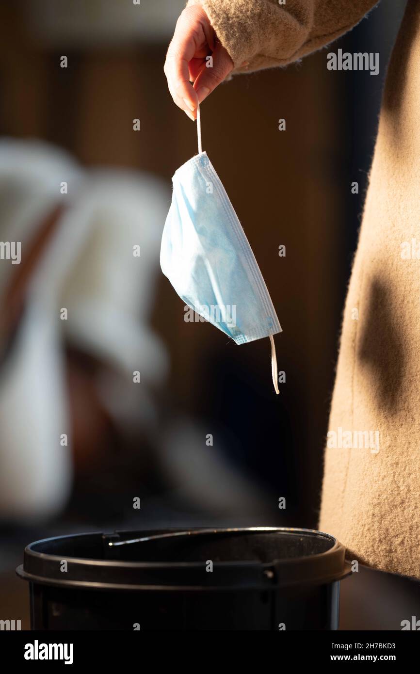 mask in bin, rubbish, garbage and trash. Littering a safety mask in ...