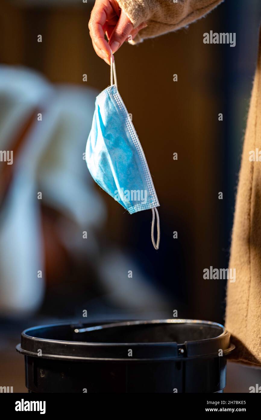 mask in bin, rubbish, garbage and trash. Littering a safety mask in ...