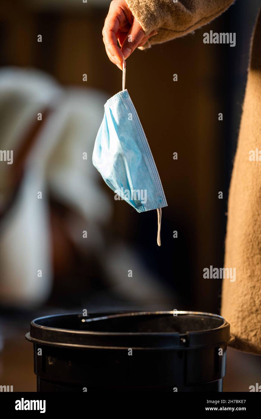 mask in bin, rubbish, garbage and trash. Littering a safety mask in ...