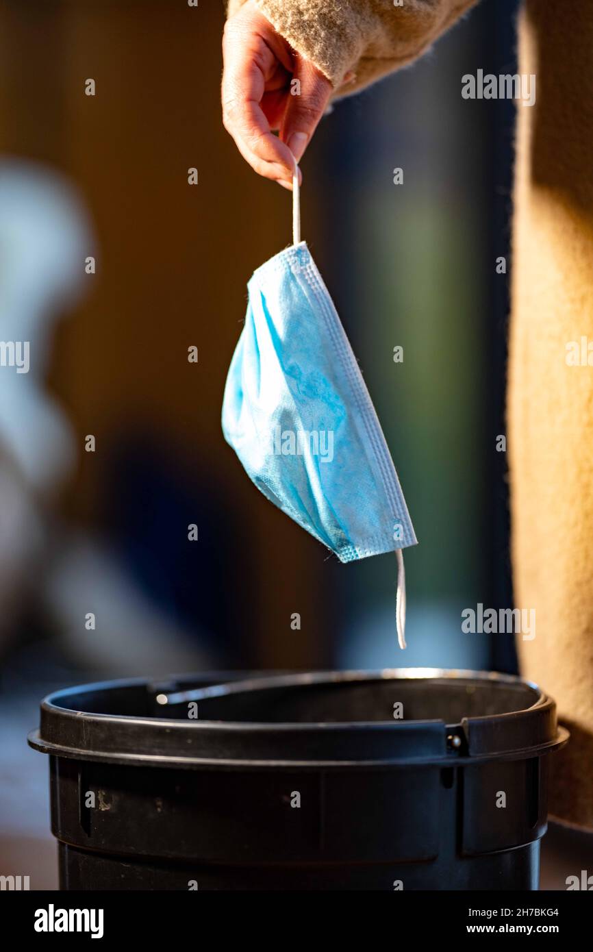 mask in bin, rubbish, garbage and trash. Littering a safety mask in ...