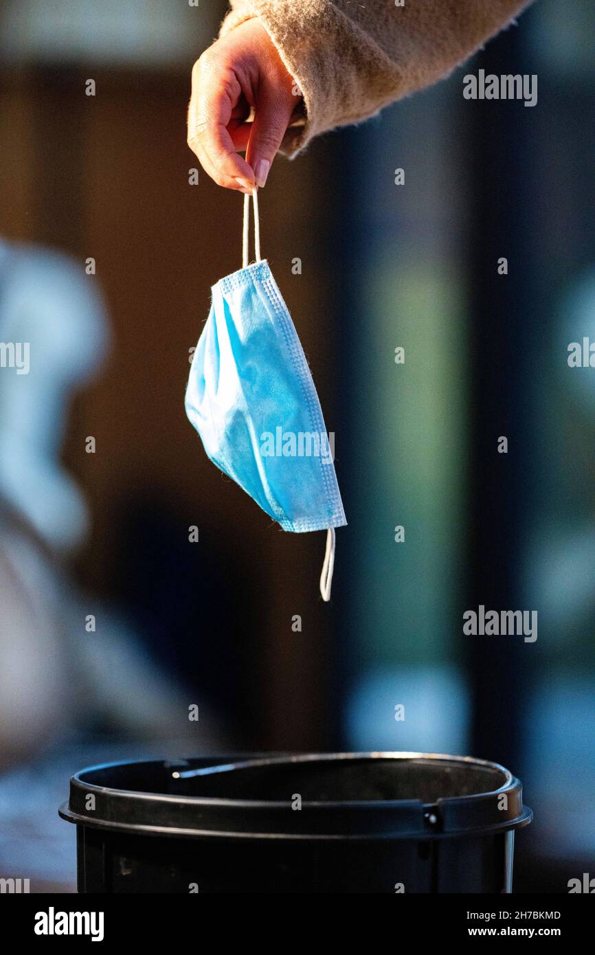 mask in bin, rubbish, garbage and trash. Littering a safety mask in ...