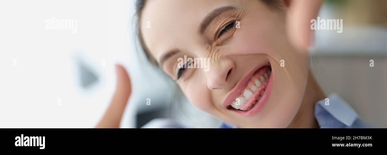 Happy smiling woman makes photo frame with her hands Stock Photo - Alamy