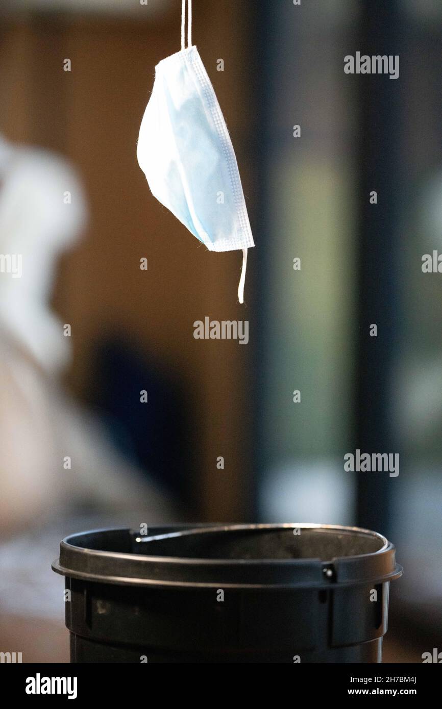 mask in bin, rubbish, garbage and trash. Littering a safety mask in ...
