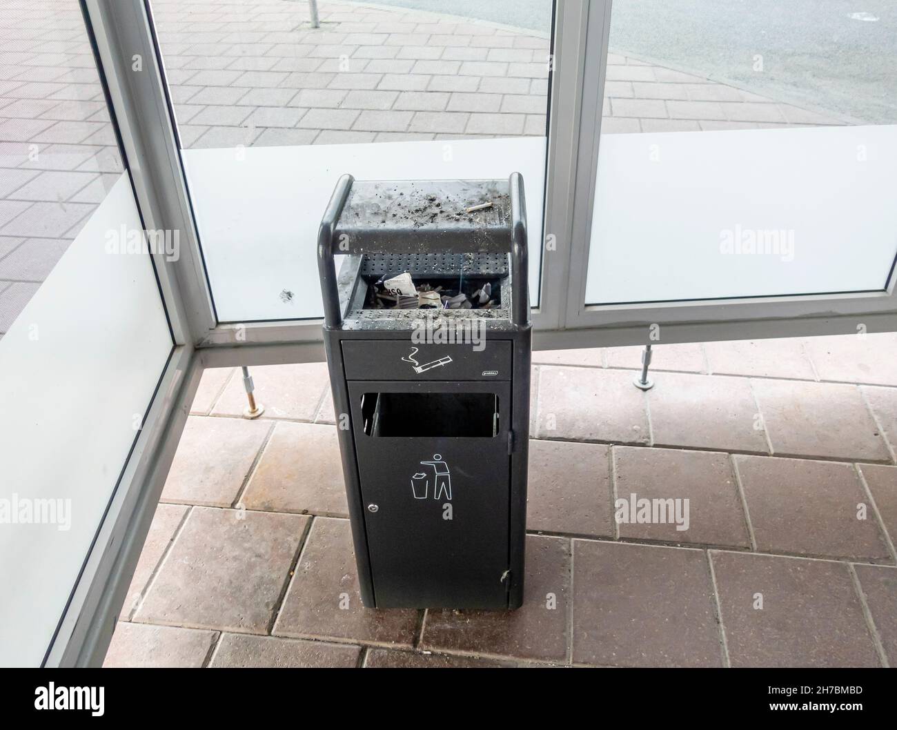 Ashtray with ash and cigarette butts in the smoking area Stock Photo ...