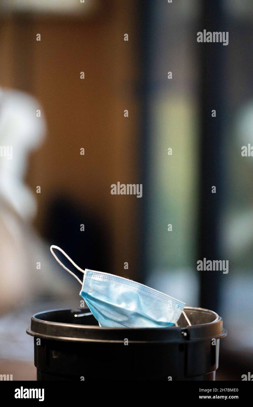 mask in bin, rubbish, garbage and trash. Littering a safety mask in ...