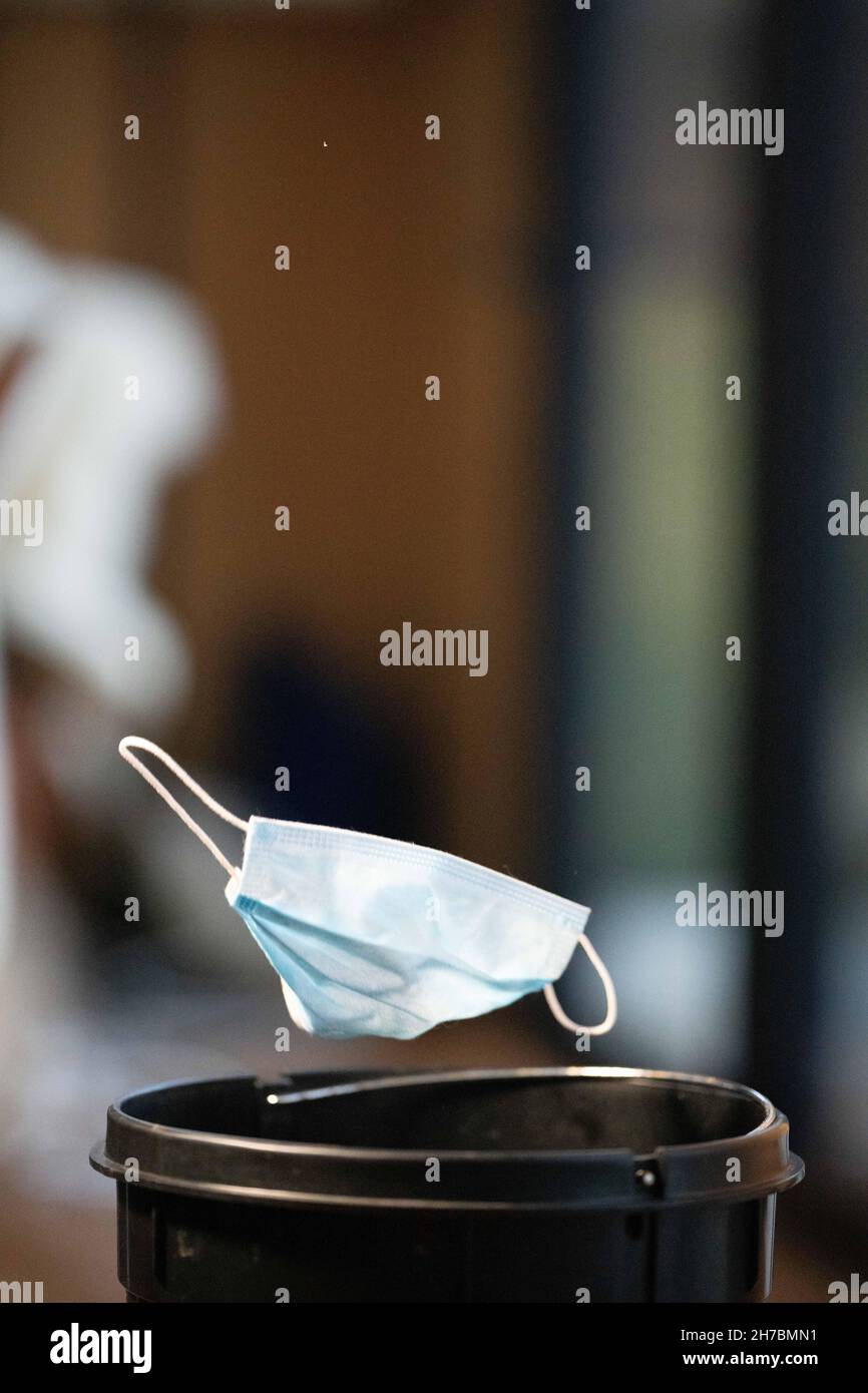 mask in bin, rubbish, garbage and trash. Littering a safety mask in ...