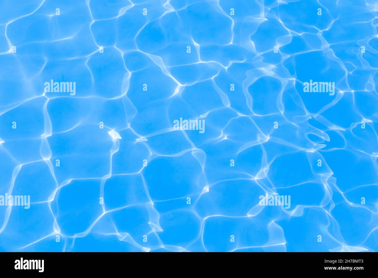 Swimming Pool Surface reflection background Stock Photo - Alamy